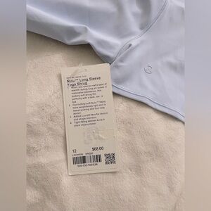lululemon athletica | Tops | Lululemon Nwt Nulu Long Sleeve Yoga Shrug ...